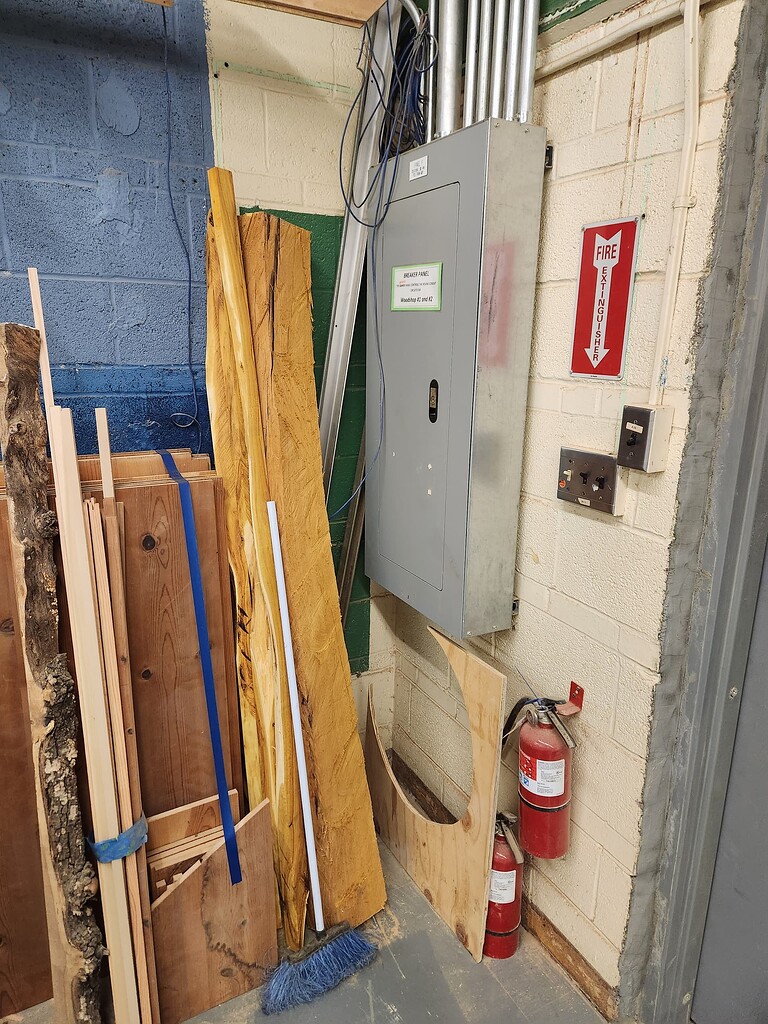 Clear space in front of electrical panels - Wood Shop - MakeICT